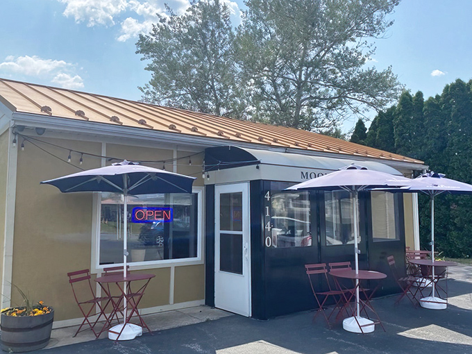 The unassuming exterior of Moonlight Café proves once again that culinary treasures often hide in plain sight, with cheerful patio seating inviting you to linger.