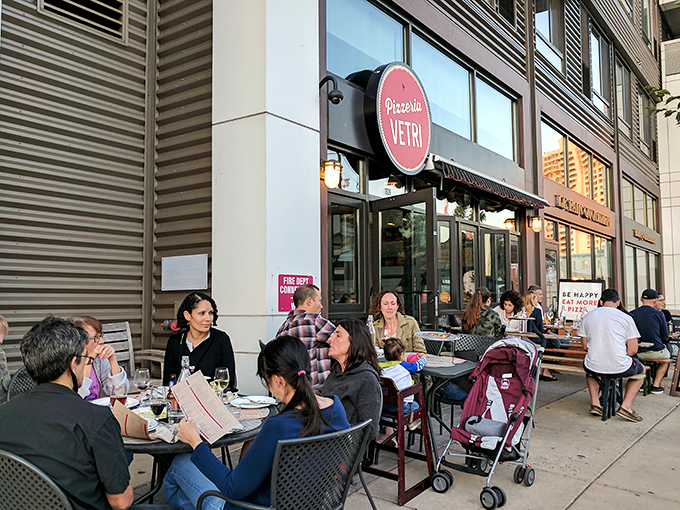 The bright red Pizzeria Vetri sign beckons like a pizza lighthouse, guiding hungry Philadelphians to their happy place. Outdoor seating perfect for people-watching.