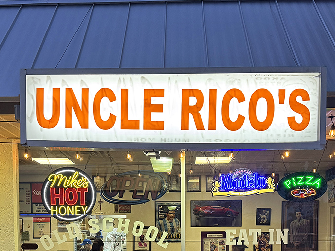 The unassuming storefront with its bold orange signage promises what every great pizza place should: no pretension, just pizza perfection waiting inside.