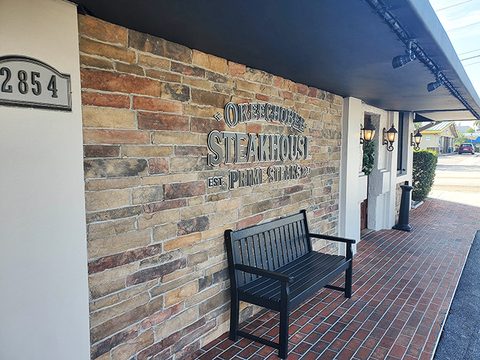 That elegant doorway has welcomed steak enthusiasts since 1947. Like a beef-scented time machine, it transports you to an era when dinner was an event.