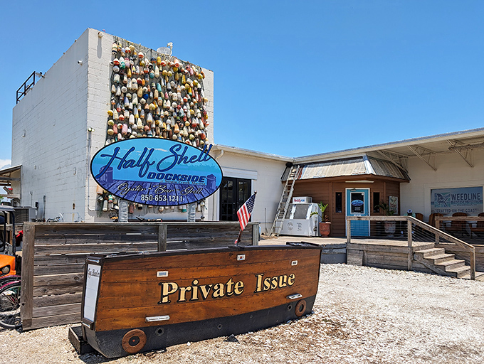 That wall of buoys isn't just decoration—it's a colorful maritime resume showcasing years of Gulf fishing heritage.