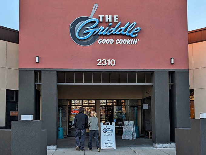 The Griddle's exterior promises "Good Cookin'" &ndash; perhaps the breakfast understatement of the century. That blue neon sign beckons like a lighthouse for the hungry and caffeine-deprived.