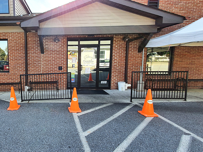 The unassuming entrance to barbecue paradise. Those orange cones aren't directing traffic&mdash;they're guiding hungry souls to smoked meat nirvana.