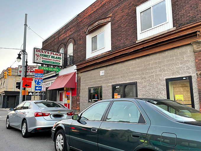 The unassuming brick exterior of Duly's Place hides culinary treasures within. That vintage sign has been guiding hungry Detroiters to happiness for generations.