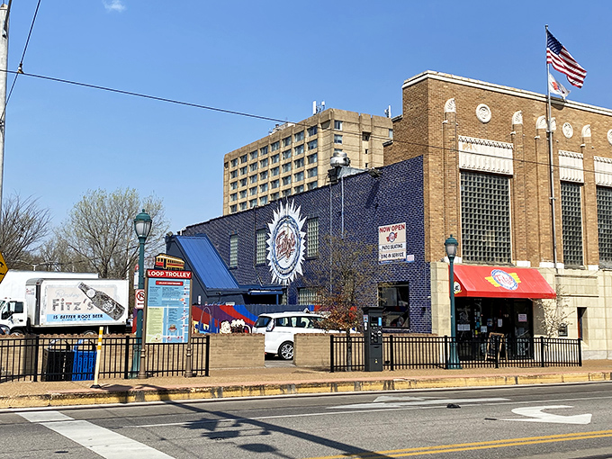The iconic blue facade of Fitz's stands proudly on Delmar Boulevard, like a fizzy beacon calling hungry travelers home.