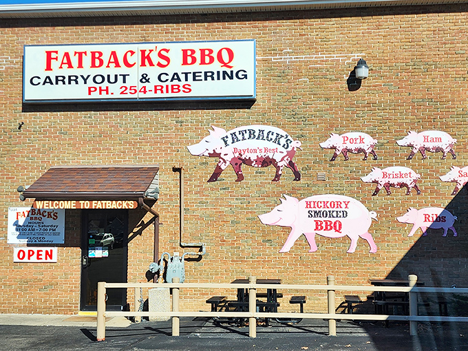 The pig silhouettes on Fatback's brick exterior aren't just decoration&mdash;they're a roadmap to carnivorous bliss. BBQ paradise, straight ahead!