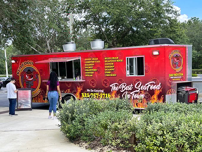 The fiery red Seafood Bandits truck stands out like a culinary beacon in Orlando, promising seafood treasures that would make Neptune himself place a to-go order.