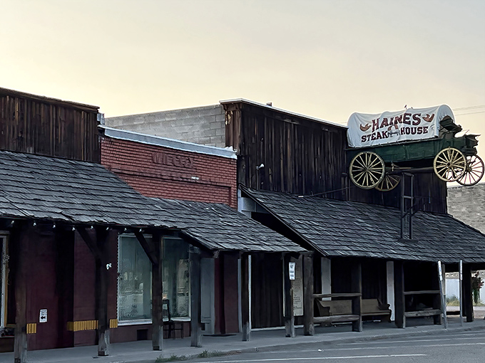 The iconic wagon sign perched atop Haines Steak House isn't just decoration&mdash;it's a beacon calling hungry travelers from miles around to this rustic wooden treasure.
