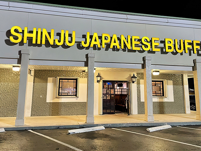 The bright yellow sign of Shinju Japanese Buffet glows like a beacon in the night, promising culinary adventures that await inside this Miami favorite.