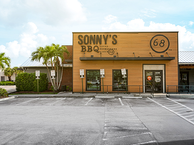 The wooden facade of Sonny's BBQ stands like a beacon of hope for hungry travelers – promising smoky salvation behind those unassuming doors.