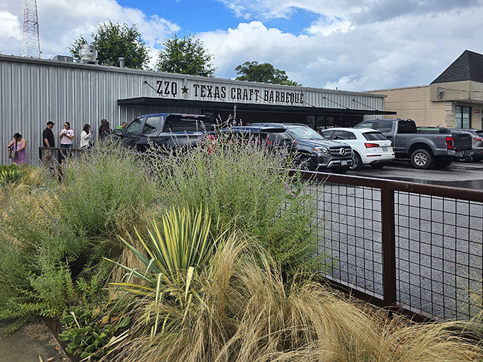 The unassuming exterior of ZZQ hides the smoky treasures inside, with eager customers lining up outside for a taste of Texas-style barbecue now thriving in Virginia.