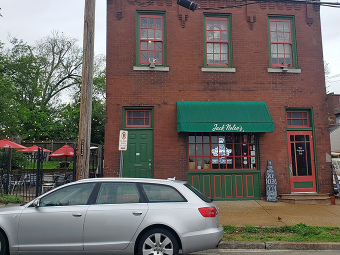 The brick facade and emerald awning of Jack Nolen's stands like a burger beacon in St. Louis's historic Soulard neighborhood, promising smashed perfection within.