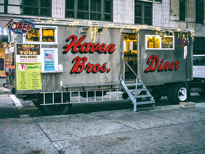 The silver chariot of late-night cravings, Haven Brothers Diner gleams under city lights like a beacon for hungry night owls seeking salvation in sandwich form.