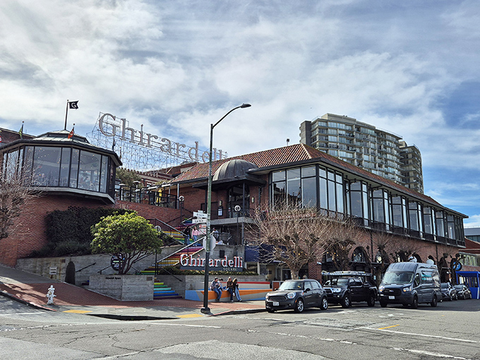 From street level, Ghirardelli's iconic sign glows like a lighthouse for chocolate lovers, guiding the dessert-obsessed safely to shore.