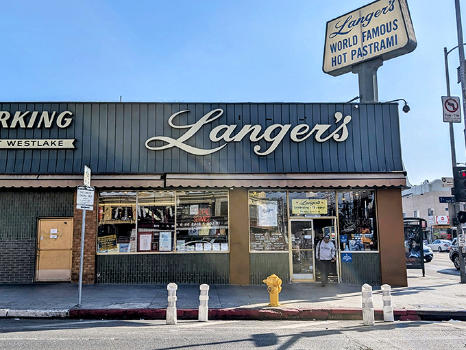 The iconic blue exterior of Langer's, where that "World Famous Hot Pastrami" sign has been beckoning sandwich pilgrims for generations.