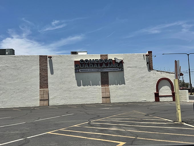 The unassuming white exterior of Comedor Guadalajara stands like a blank canvas, promising culinary masterpieces within. Desert sunshine only enhances the anticipation.