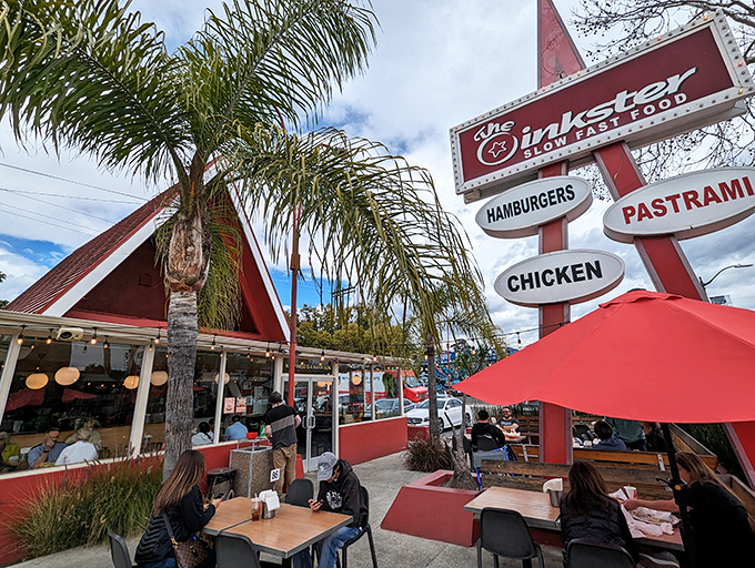 The iconic red A-frame beckons hungry travelers like a mid-century mirage, promising burgers and pastrami worth the pilgrimage to Eagle Rock.