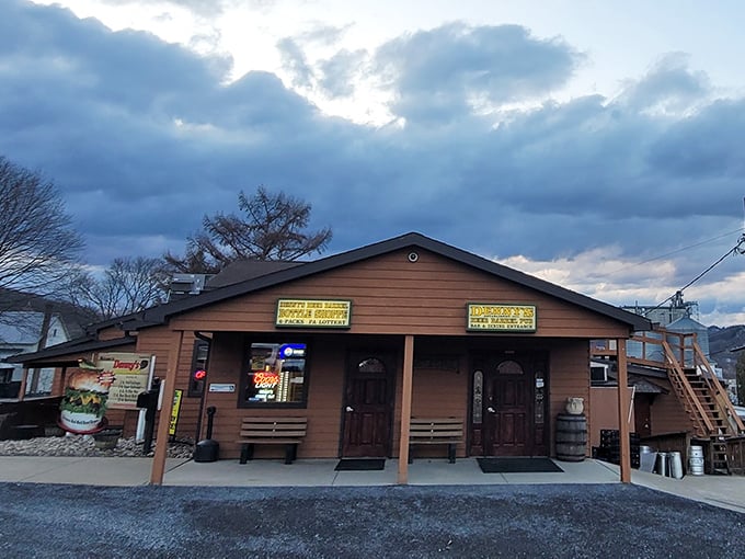 The unassuming exterior of Denny's Beer Barrel Pub hides a burger paradise within. Like finding a treasure chest disguised as a garden shed.