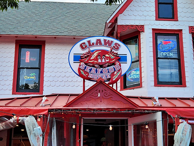 The iconic white clapboard exterior of Claws Seafood House beckons seafood lovers with its cheerful red trim and can't-miss crab sign. Delaware beach dining at its most inviting!