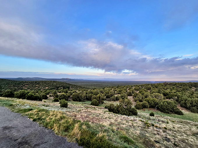 Mother Nature's panoramic masterpiece unfolds at Munds Park, where juniper-dotted landscapes stretch toward distant mountains like a living topographical map.
