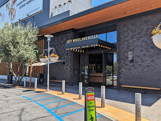 The sleek brick exterior of JOEY Woodland Hills promises sophistication without pretension&mdash;like your coolest friend who somehow always knows the best spots.