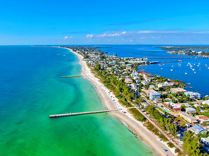 The island's distinctive shape cradles both Gulf and bay waters, offering residents twice the waterfront views and double the sunset-watching opportunities.