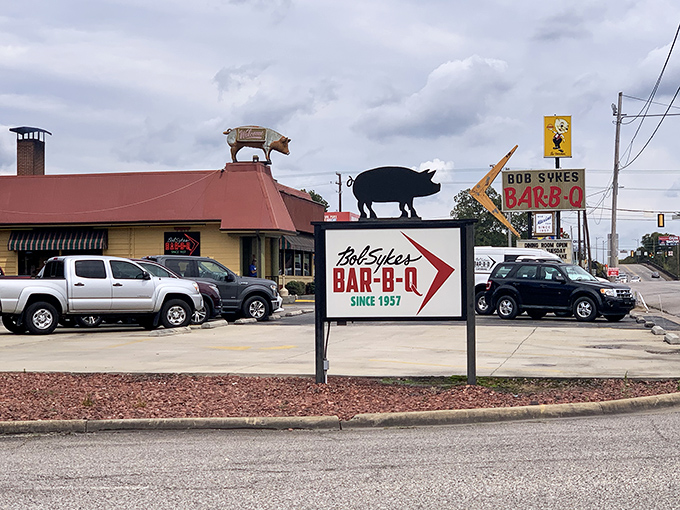The iconic pig silhouette atop Bob Sykes BAR-B-Q isn't just decoration—it's a beacon of hope for hungry travelers seeking smoky salvation in Bessemer.