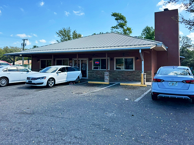 The iconic terracotta-colored exterior with its distinctive chimney and chef mascot announces you've arrived at BBQ heaven. No fancy frills needed.
