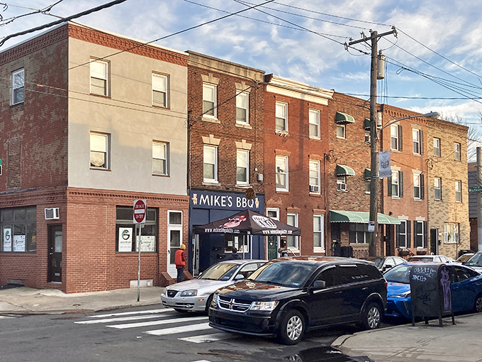 The blue storefront of Mike's BBQ stands out on this South Philly street like a beacon of smoky hope for hungry carnivores everywhere.