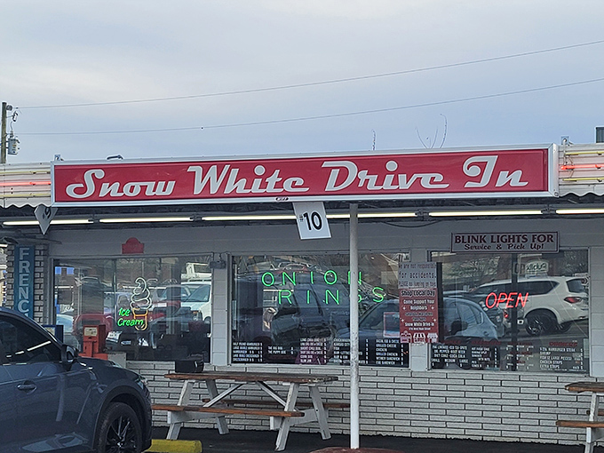 That classic red sign beckons hungry travelers like a neon lighthouse, guiding you to a shore where calories don't count and nostalgia flows freely.