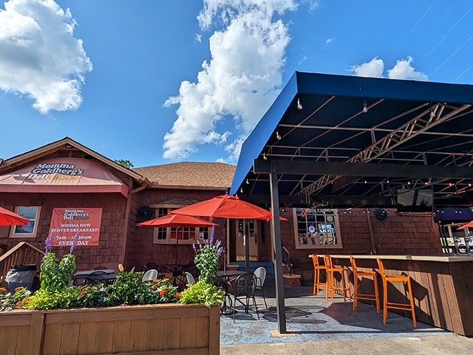Rustic charm meets sandwich paradise under this blue canopy, where orange bar stools invite you to perch and ponder life's important question: one sandwich or two?