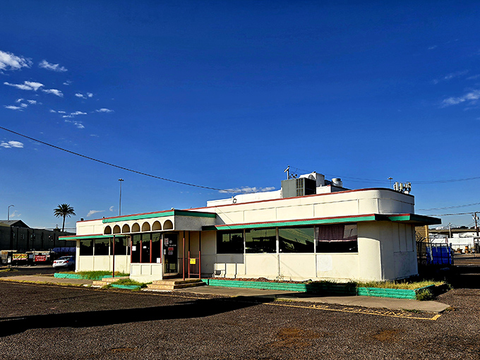 Standing proudly against the Arizona sky, Mel's Diner's white-and-mint exterior is like a time machine disguised as a building.