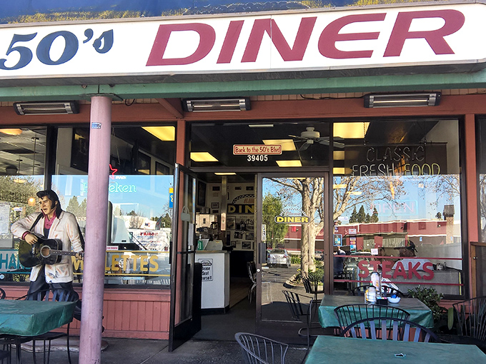 The burgundy awning and Elvis statue standing guard promise a time-traveling breakfast experience that won't disappoint your taste buds or your wallet.