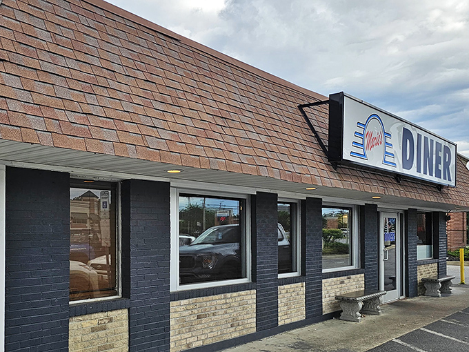Another angle of Marie's exterior showcases its classic diner architecture&mdash;brick, large windows, and that unmistakable sign that says "good food happens here."