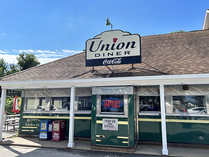 The classic Coca-Cola sign and strawberry logo announce your arrival at breakfast paradise. This isn't just a diner&mdash;it's a morning sanctuary.