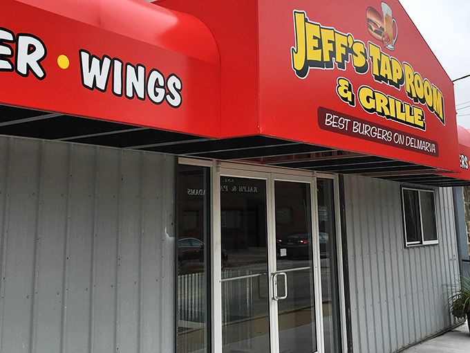 The bright red awning of Jeff's Taproom & Grille stands out like a culinary lighthouse, boldly proclaiming "BEST BURGERS ON DELMARVA" &ndash; a promise they deliver on with gusto.