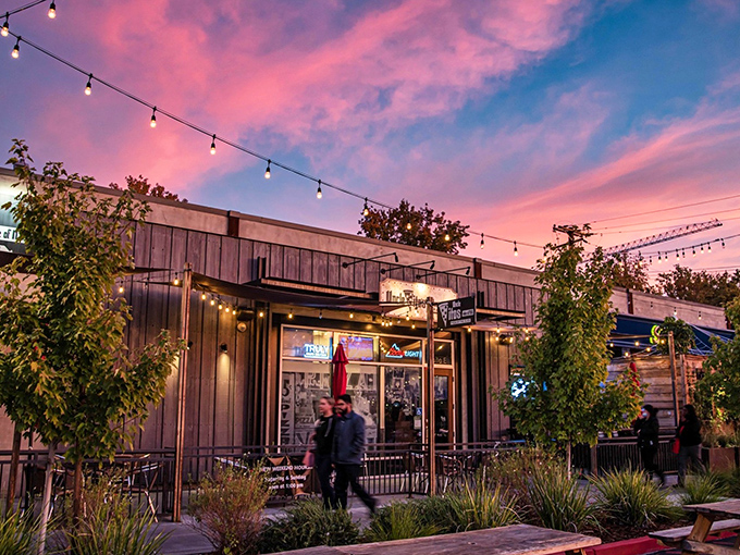 Sunset magic at Uncle Vito's, where those string lights aren't just decoration&mdash;they're beacons guiding hungry souls to pizza paradise.