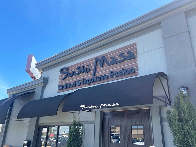 Sleek signage against a perfect Louisiana sky &ndash; Sushi Masa's exterior is like the opening credits to your next favorite food adventure.