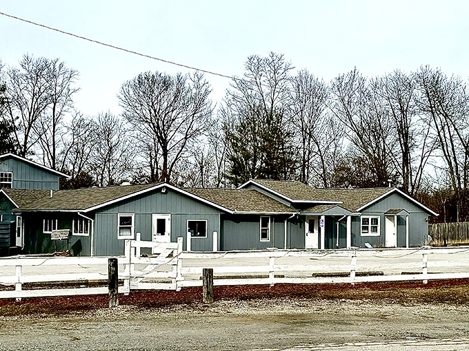 The unassuming blue exterior of Capricorn Inn might not scream "culinary destination," but that white picket fence practically whispers, "come taste what the locals already know."