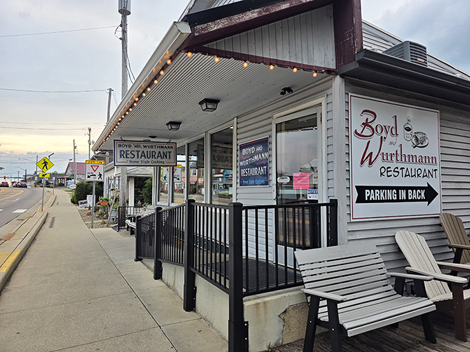 Twilight transforms this humble eatery into a beacon for hungry travelers. Those string lights aren't just decoration&mdash;they're a dinner bell for comfort food pilgrims.