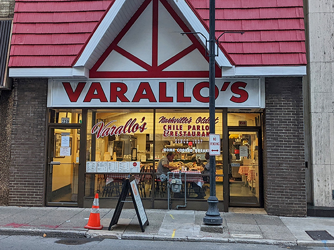 The iconic red-trimmed storefront of Varallo's stands as Nashville's culinary time machine, beckoning hungry patrons with its vintage charm and legendary status.