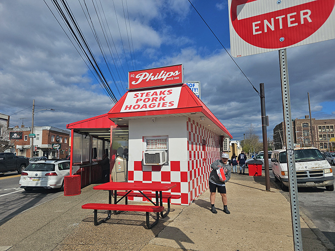 The red and white checkerboard pattern isn't just decoration—it's a Philly code for "serious sandwich business happens here."