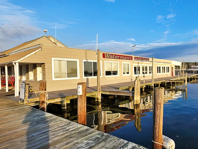 Perched on the water like a golden treasure chest, Waterman's Crab House promises seafood so fresh you might spot your dinner swimming by moments before it arrives.