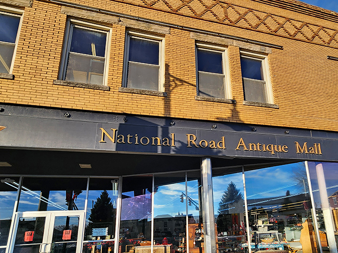 The iconic yellow brick fa&ccedil;ade of National Road Antique Mall stands proudly on Cambridge City's main street, a beacon for treasure hunters.