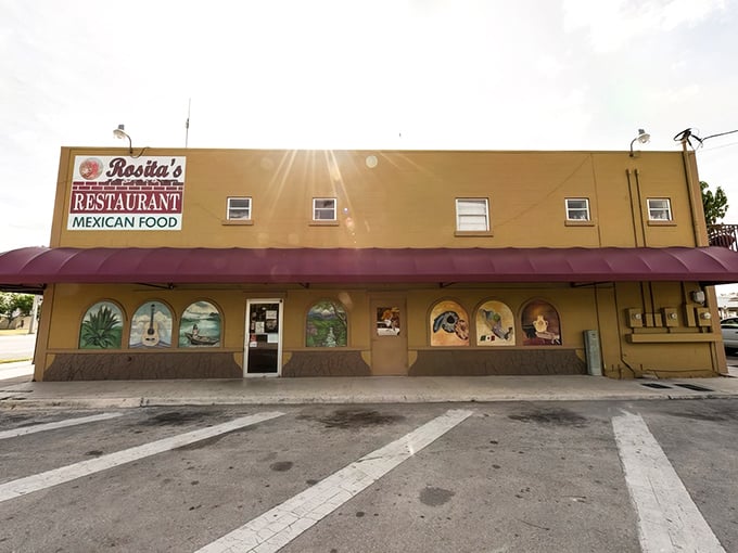 The unassuming yellow exterior of Rosita's stands like a beacon of culinary promise at Florida City's edge. Those colorful murals hint at the flavor fiesta waiting inside.