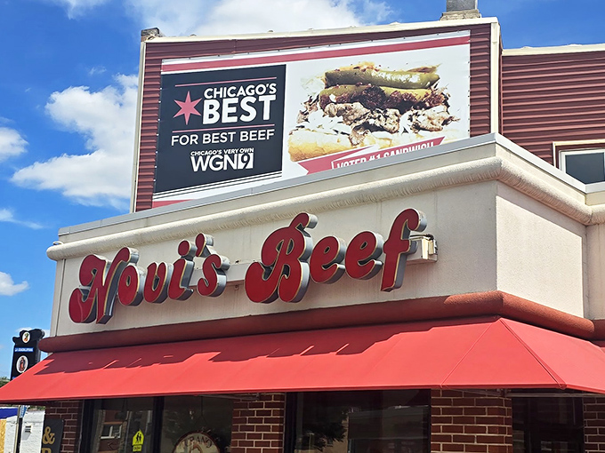 The iconic red signage of Novi's Beef stands proud against the blue sky, promising Chicago's best beef sandwiches with no false modesty.