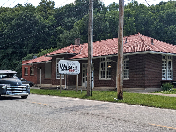 The historic brick building with its distinctive red-tiled roof stands as a delicious time capsule where railroad heritage meets mouthwatering barbecue magic.