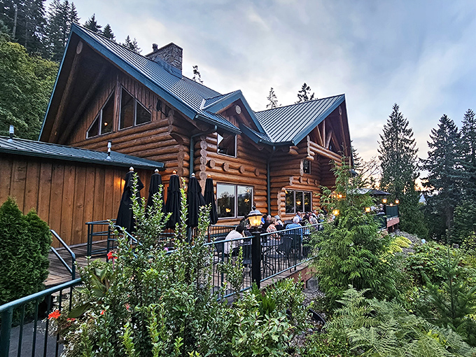 A woodland palace of culinary delights! Stone Cliff Inn's magnificent log cabin exterior promises rustic luxury before you even step inside.