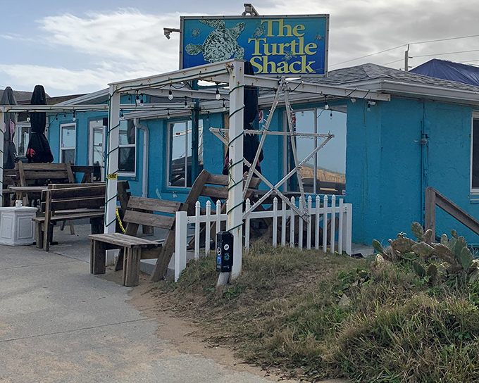 The bright turquoise exterior of Turtle Shack Café stands out against Florida's sky like a delicious mirage for hungry beachgoers.