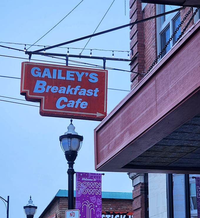The iconic orange sign beckons like a breakfast lighthouse in downtown Springfield. Simple, straightforward, and promising morning magic.